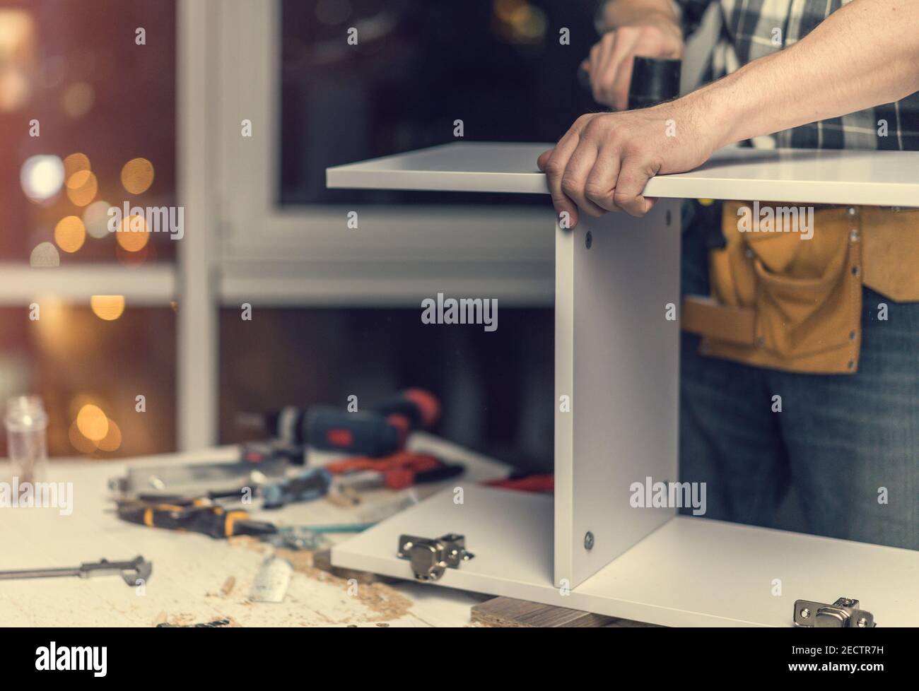 Man working during process of furniture manufacturing Stock Photo - Alamy