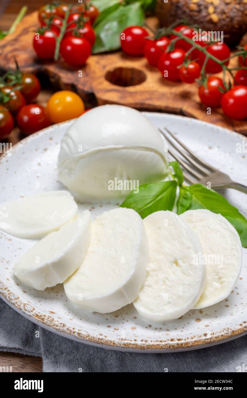 Cheese collection, eating of white soft Italian cheese mozzarella ...