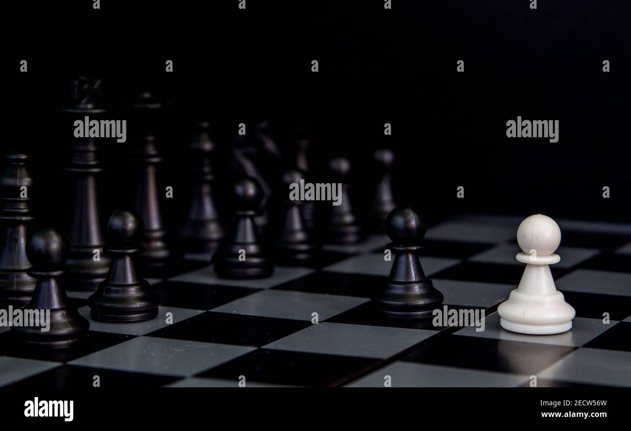 Black chess figures on board. Black chess figures row on checkered ...