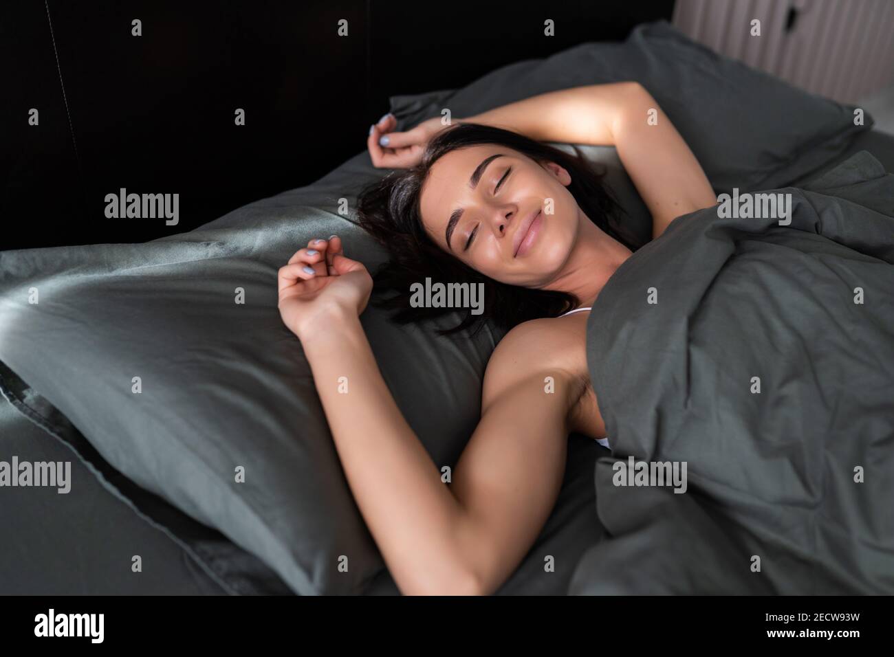 Young Beautiful Woman Waking Up In Her Bed Fully Rested Healthy
