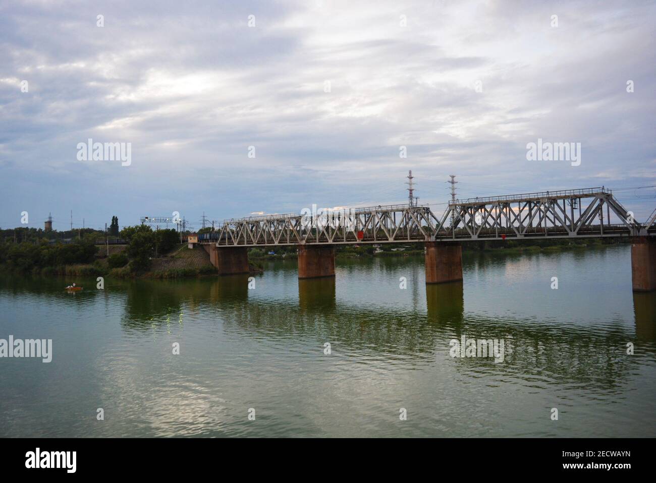 The gray Samara railway bridge over the surface of the Samara river ...