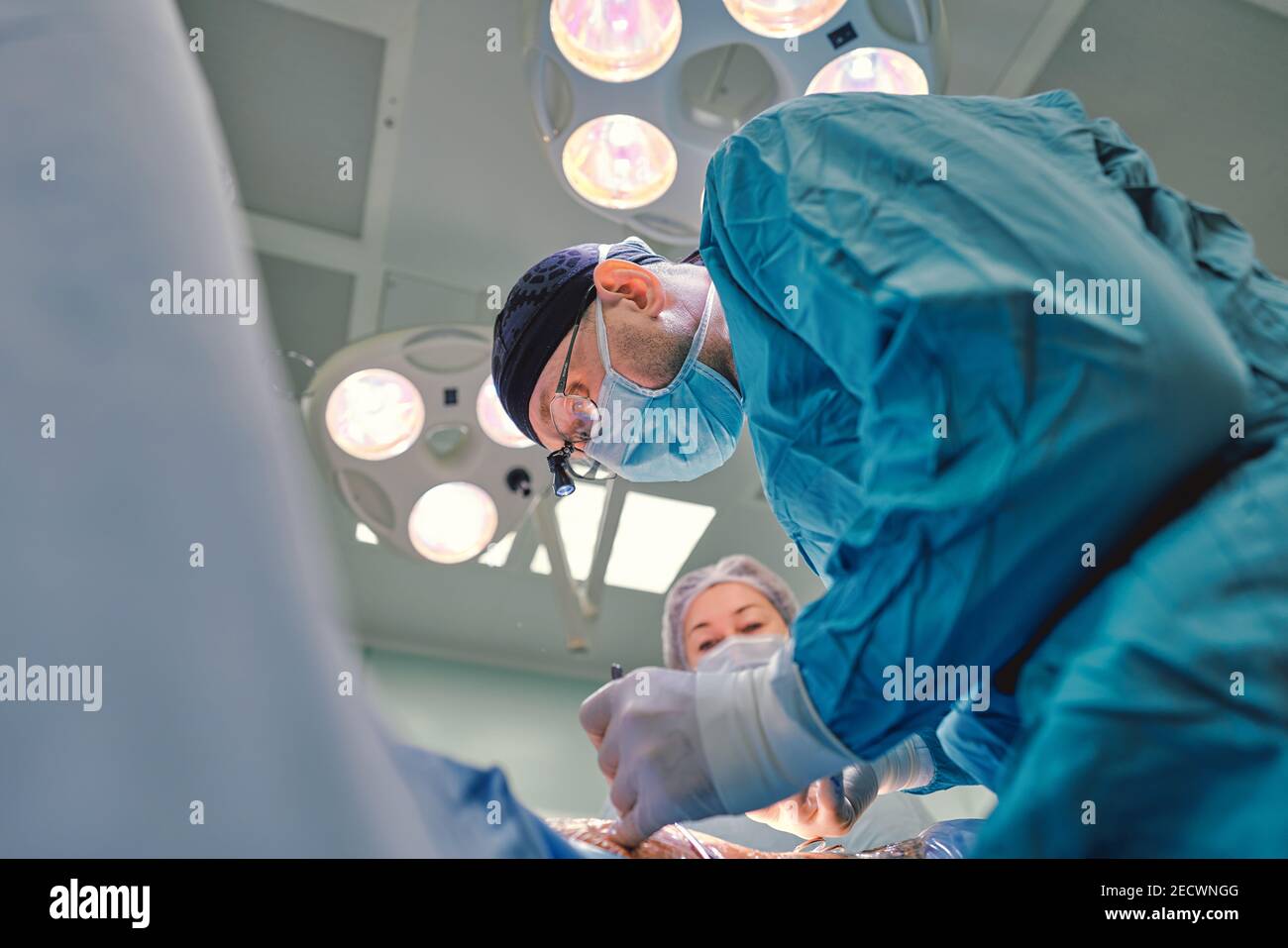 surgeon during liposuction in the operating room Stock Photo - Alamy