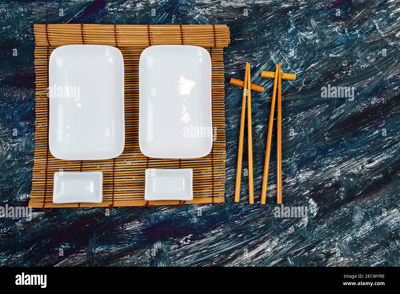 Top view of a traditional Japanese empty chopstick plate on a dark ...