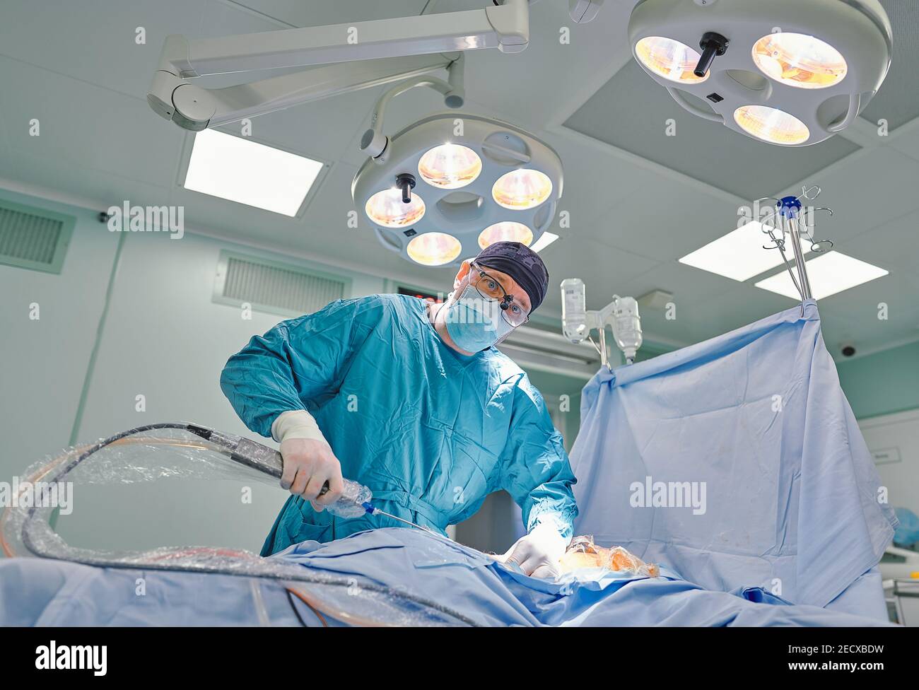 surgeon during liposuction in the operating room Stock Photo - Alamy