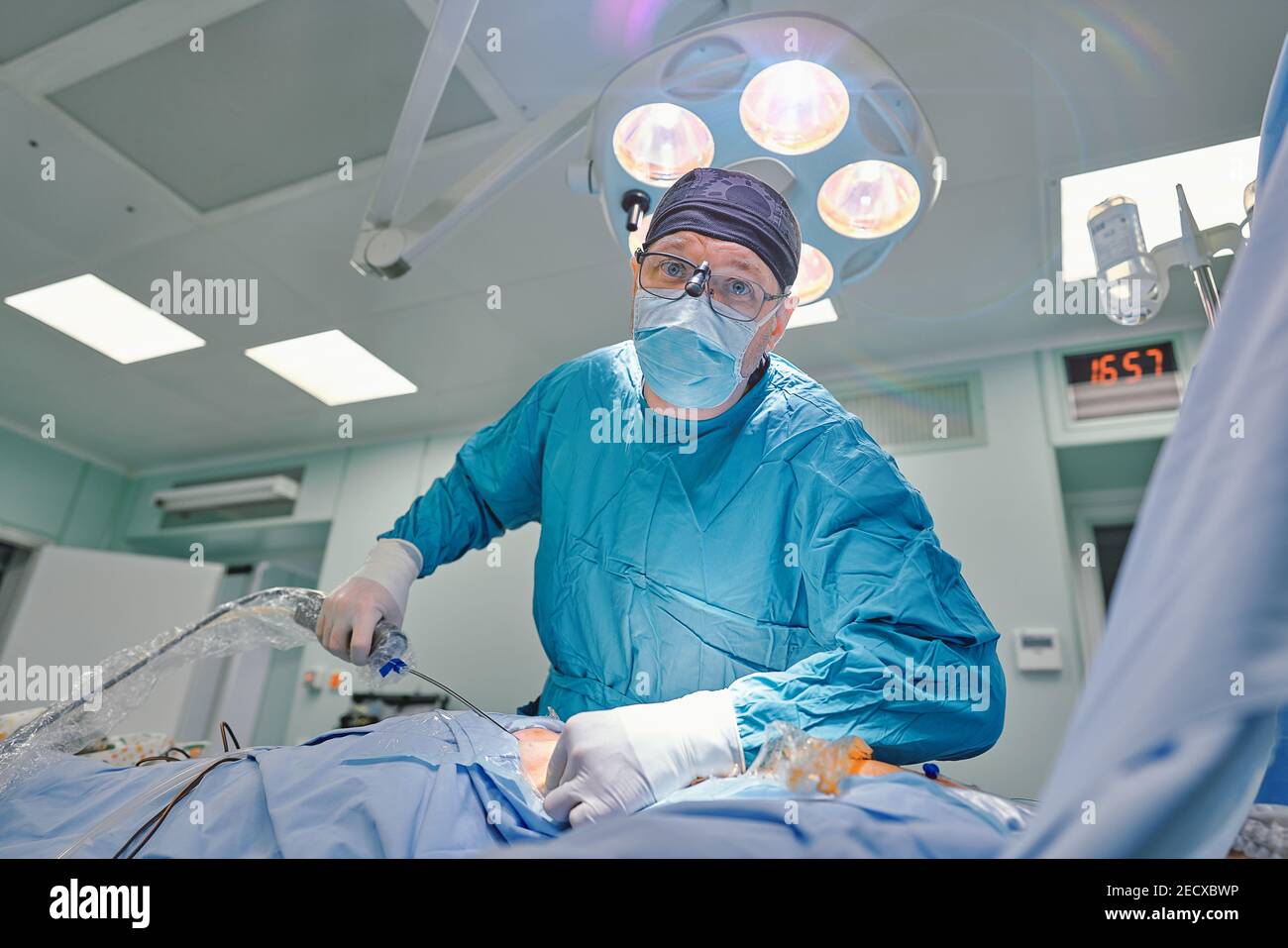 surgeon during liposuction in the operating room Stock Photo - Alamy