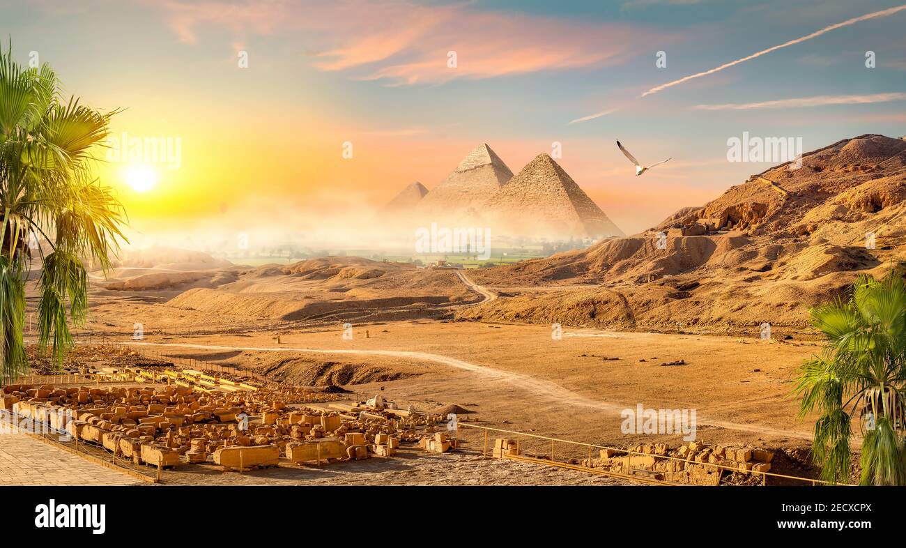 Egyptian pyramid in sand desert and clear sky Stock Photo - Alamy