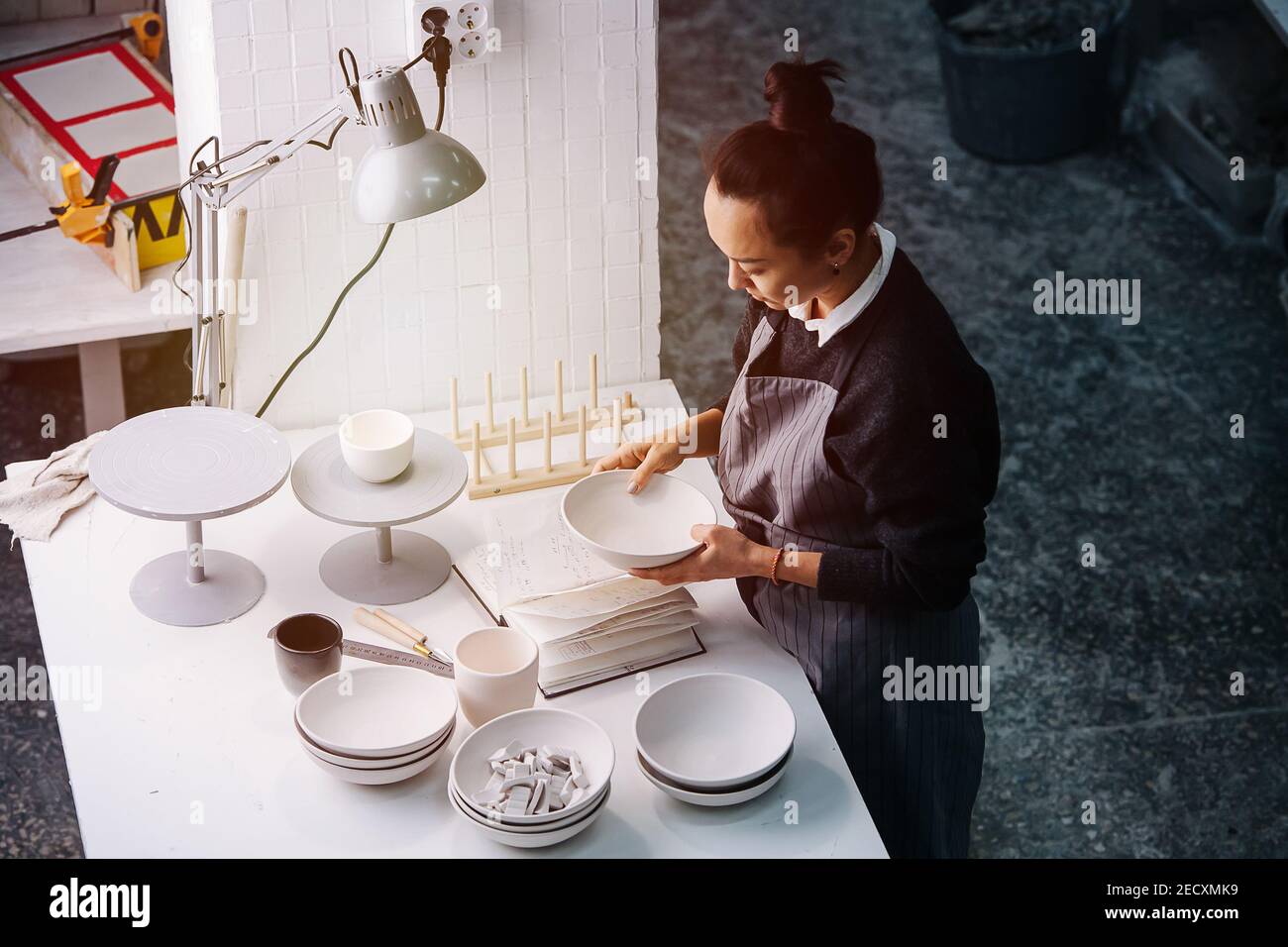Woman under the table hi-res stock photography and images - Alamy