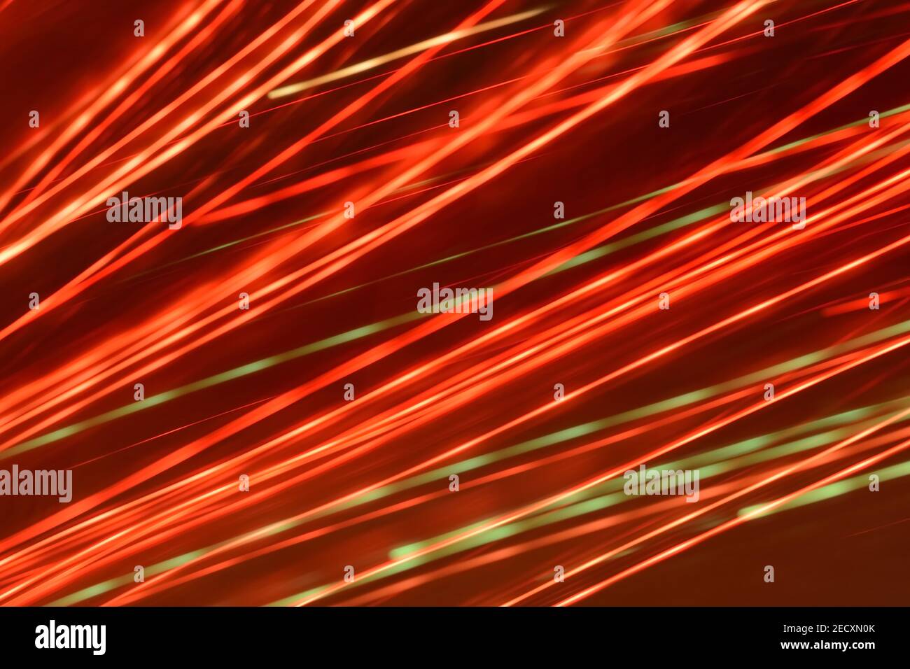Abstract background of red neon glowing light shapes. Bright stripes ...