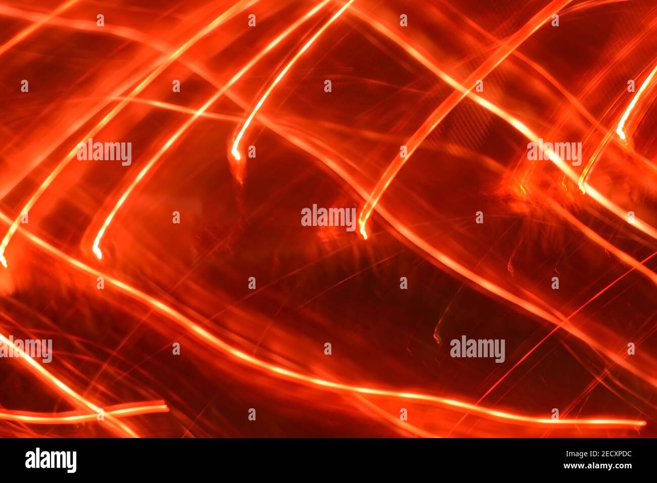 Abstract background of red neon glowing light shapes. Bright stripes ...