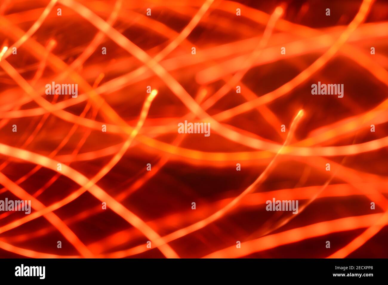 Abstract background of red neon glowing light shapes. Bright stripes ...