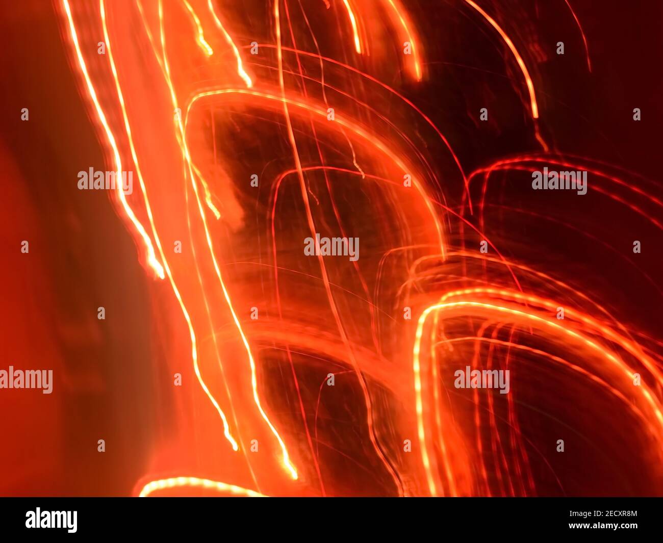 Abstract background of red neon glowing light shapes. Bright stripes ...