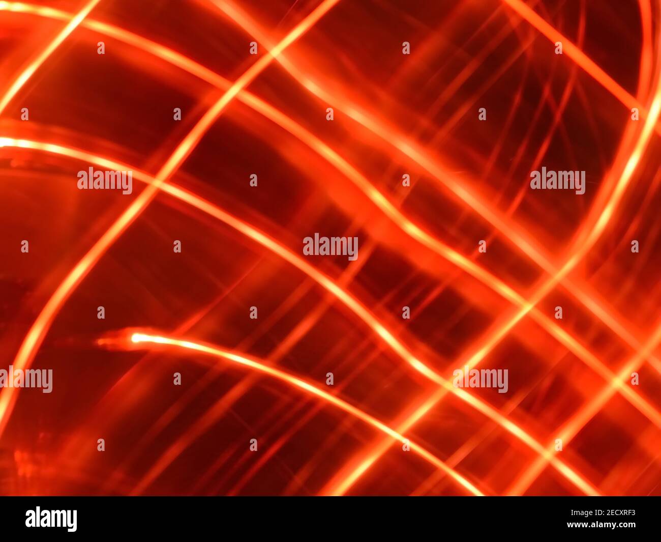 Abstract background of red neon glowing light shapes. Bright stripes ...