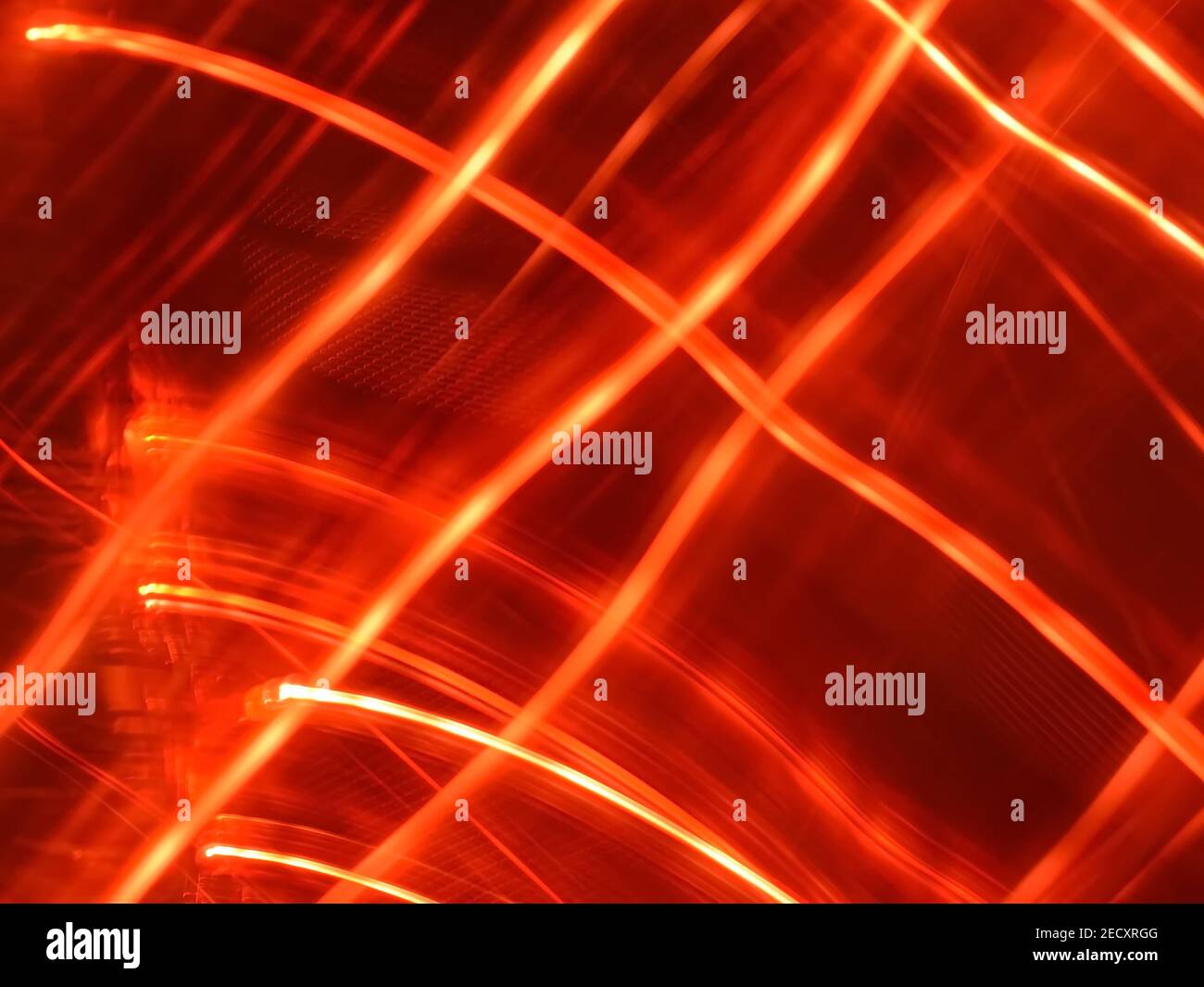 Abstract background of red neon glowing light shapes. Bright stripes ...