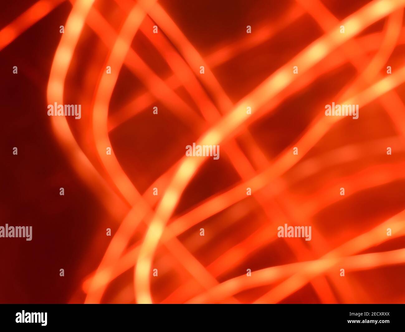 Abstract background of red neon glowing light shapes. Bright stripes ...