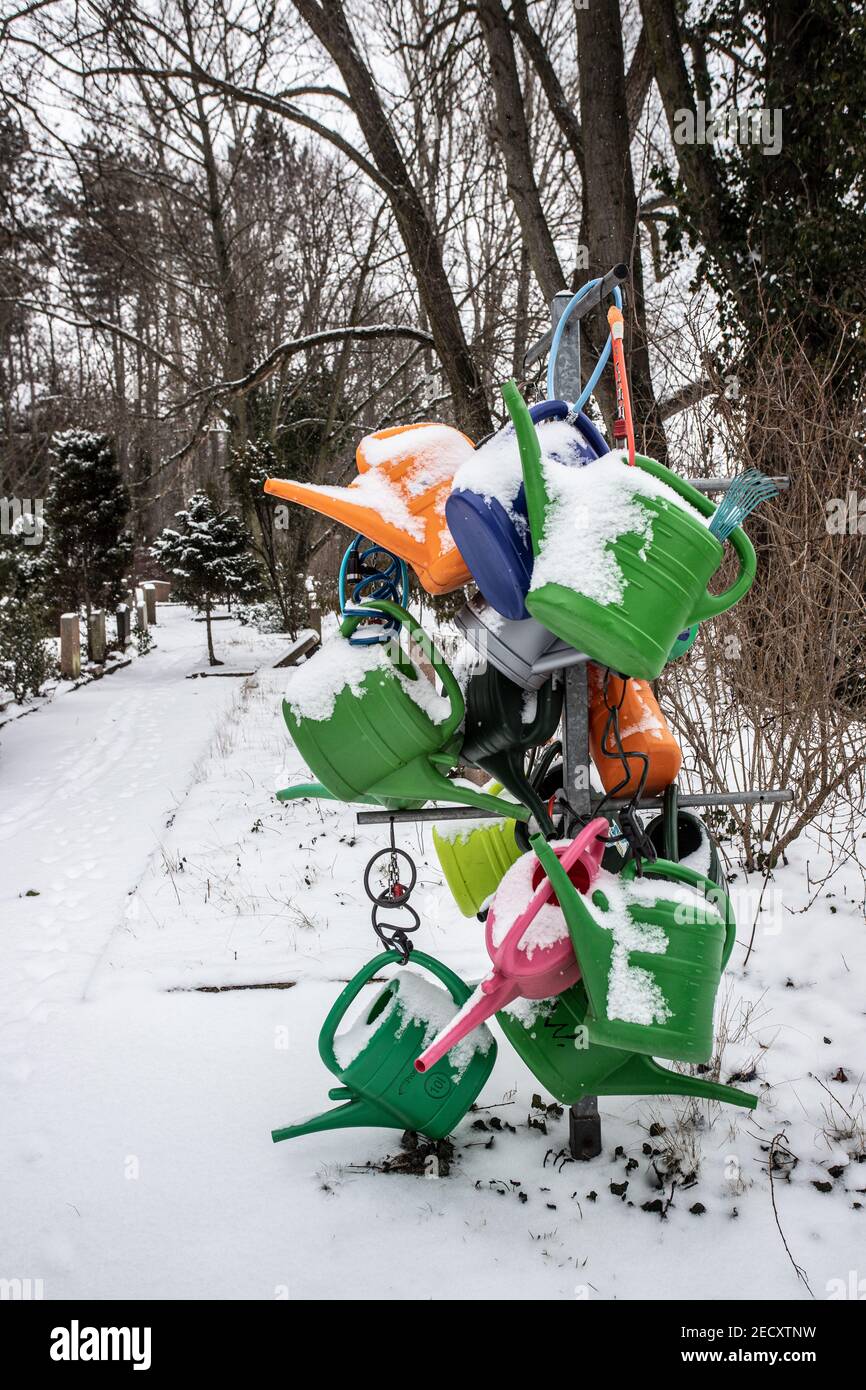 watering cans in snow Stock Photo - Alamy