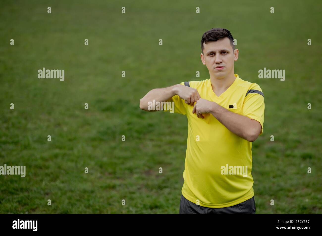 Soccer referee to point out a yellow card to a player in the soccer ...