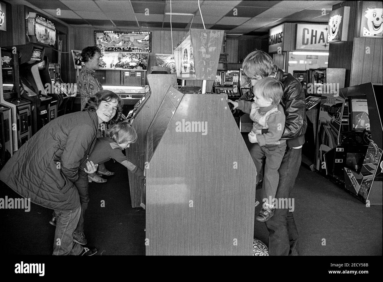 Family Playing Penny Drop Stock Photo - Alamy