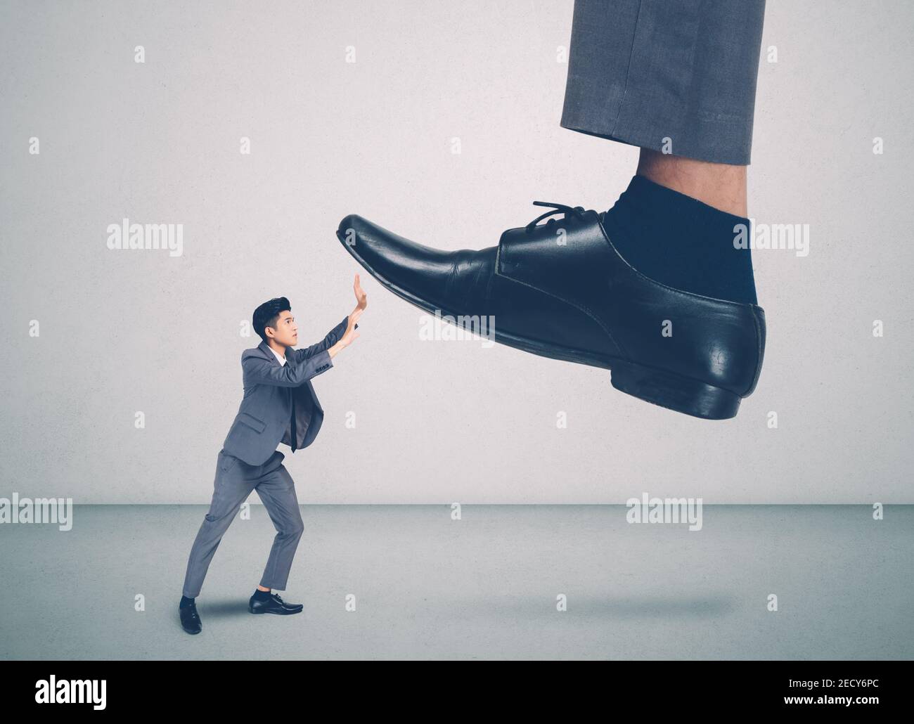 foot of leader or boss with authority huge trample on frightened ...