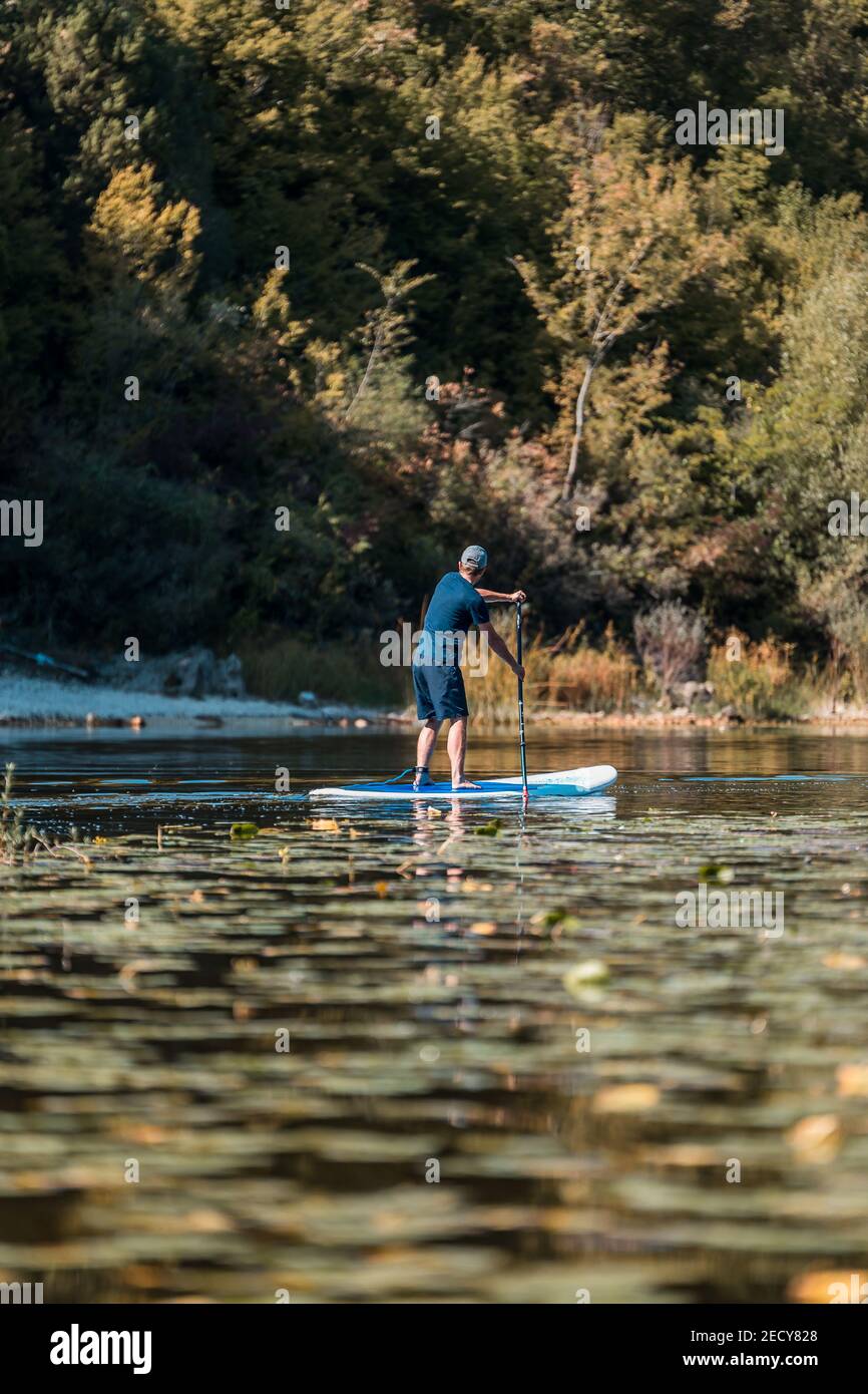 Man on paddleboard in a river hi-res stock photography and images - Alamy