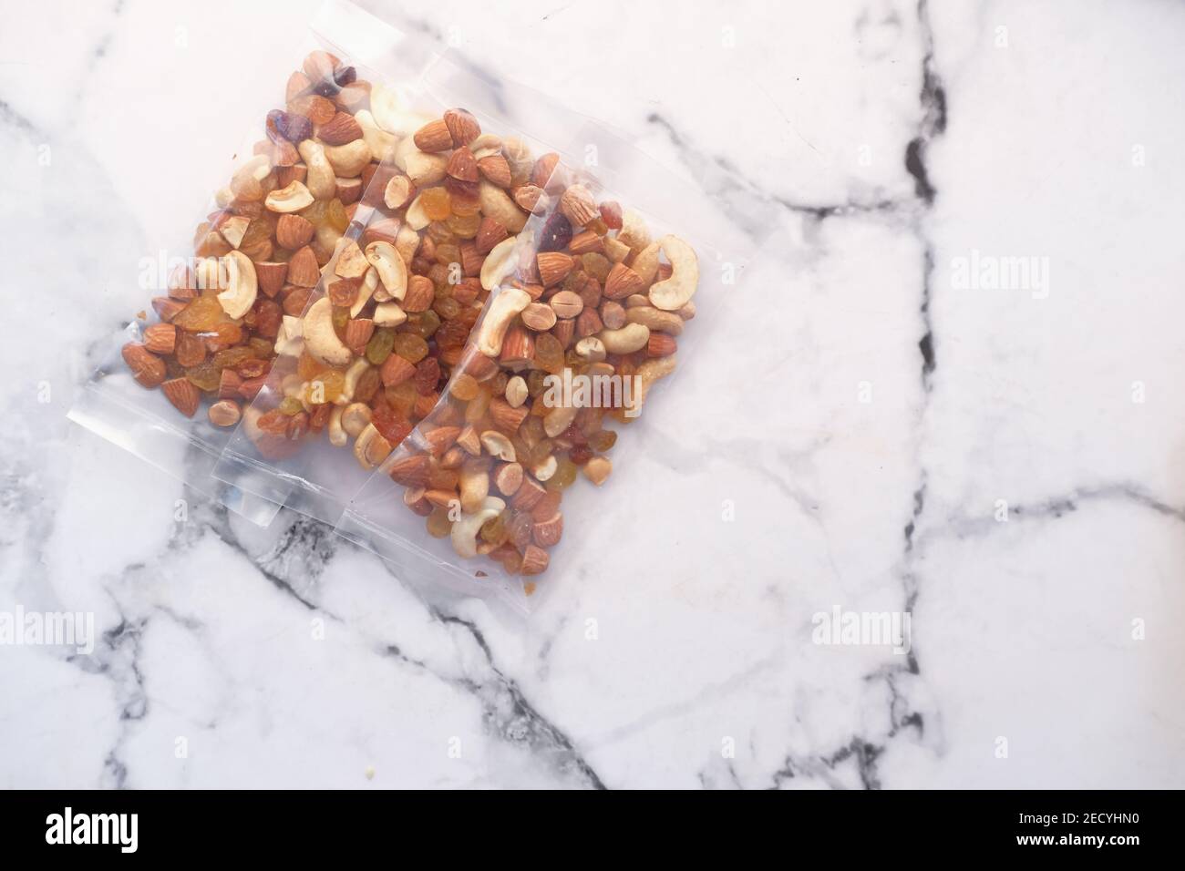 close up of many mixed nuts in a packet on table Stock Photo - Alamy