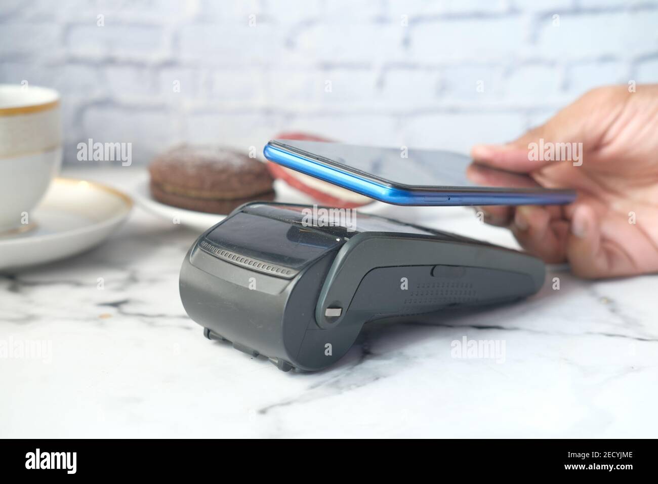making contactless payment with smart phone Stock Photo - Alamy