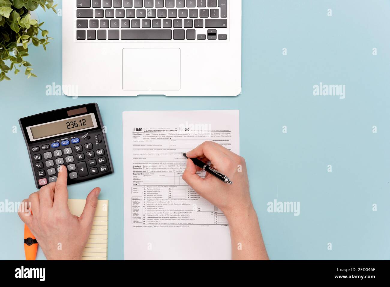 Tax income concept with US tax form. Accountant filling documents on ...