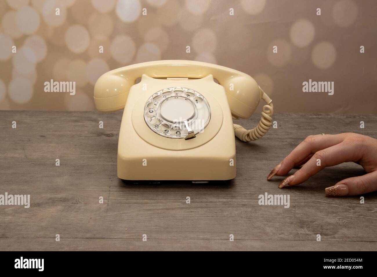A elegant woman's hand next to an old vintage 70's and 80's style ...