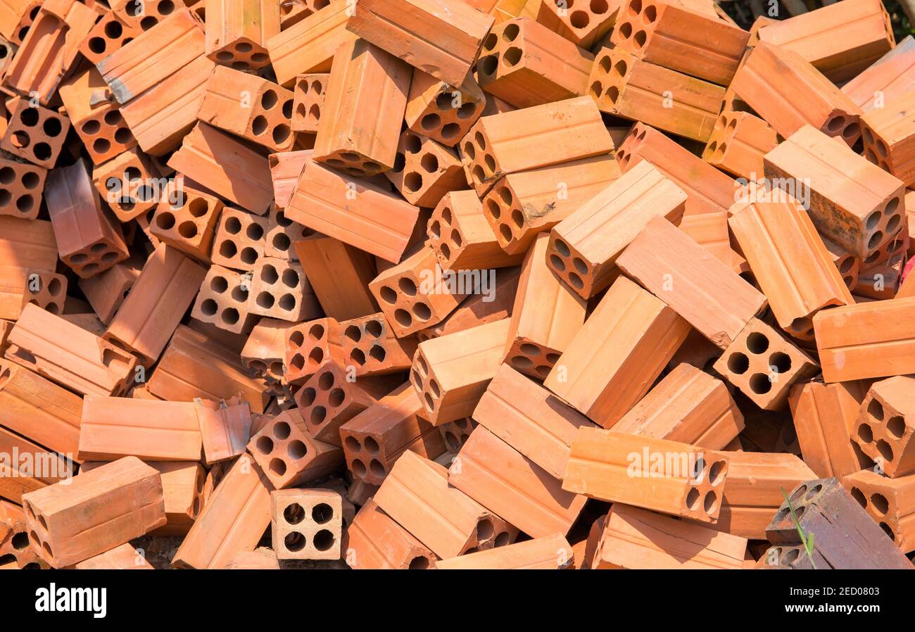 Red broken bricks. Industrial background. Construction site detail ...