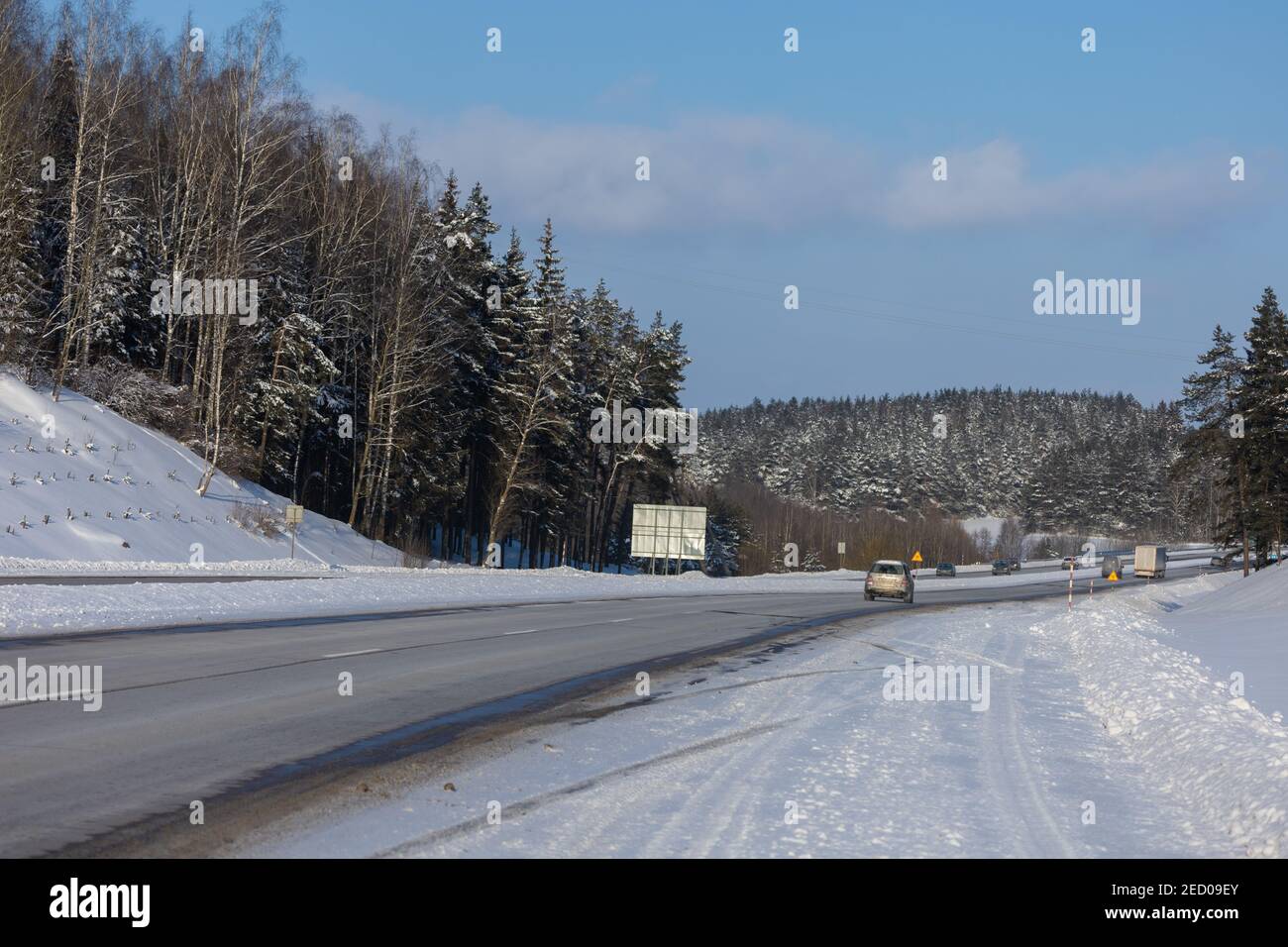 Winter road with snow, highway with cars at sunset Stock Photo - Alamy