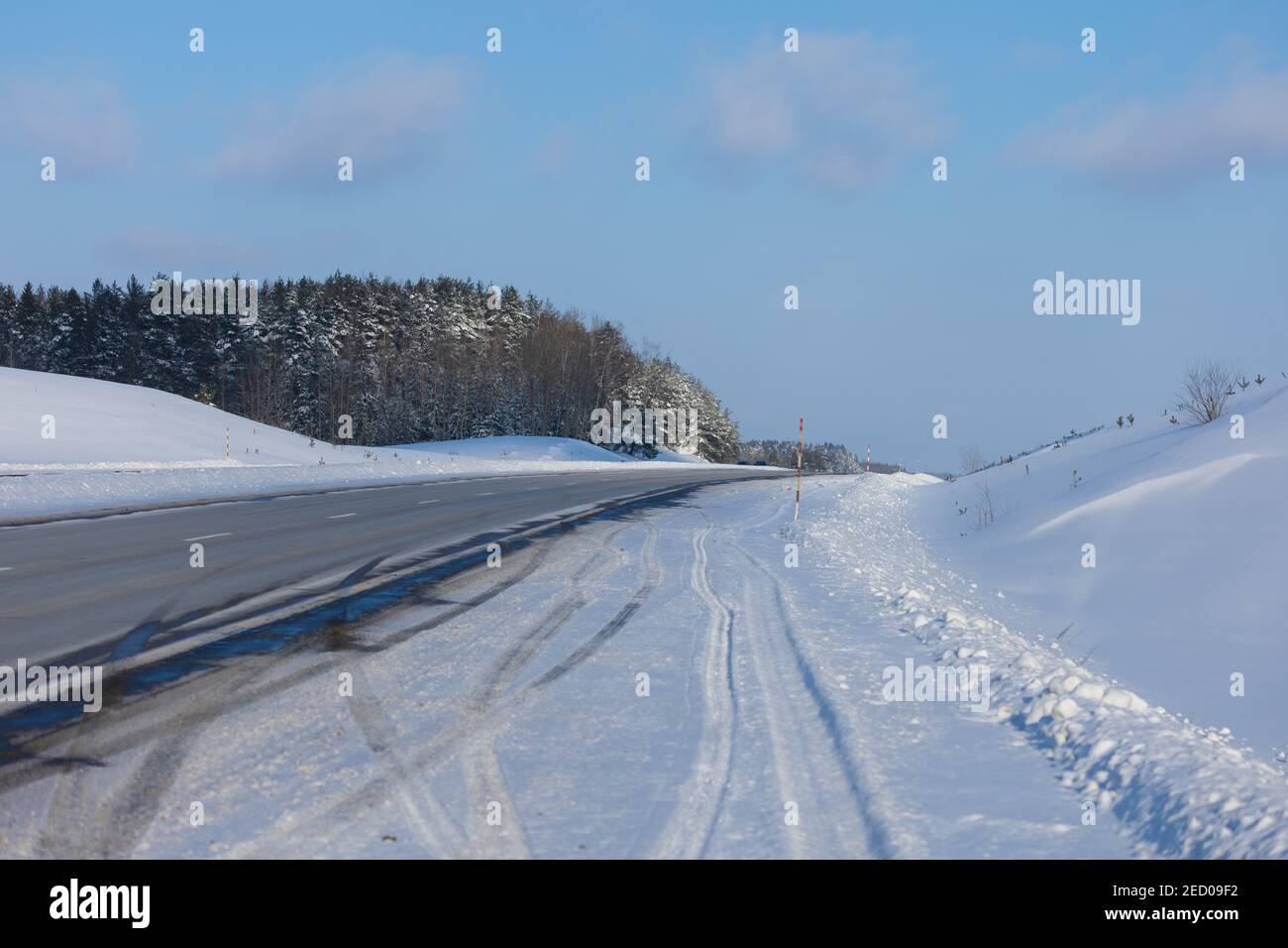Winter road with snow, highway with cars at sunset Stock Photo - Alamy