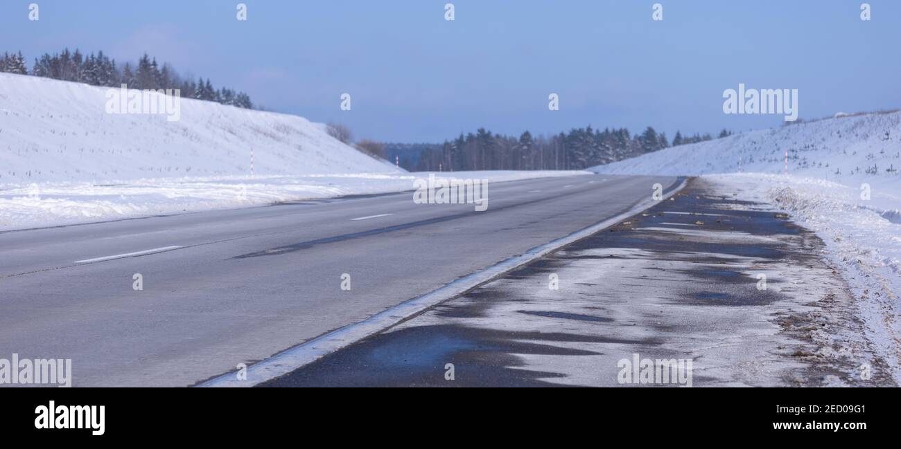Winter landscape, road and shoulder covered with snow Stock Photo - Alamy