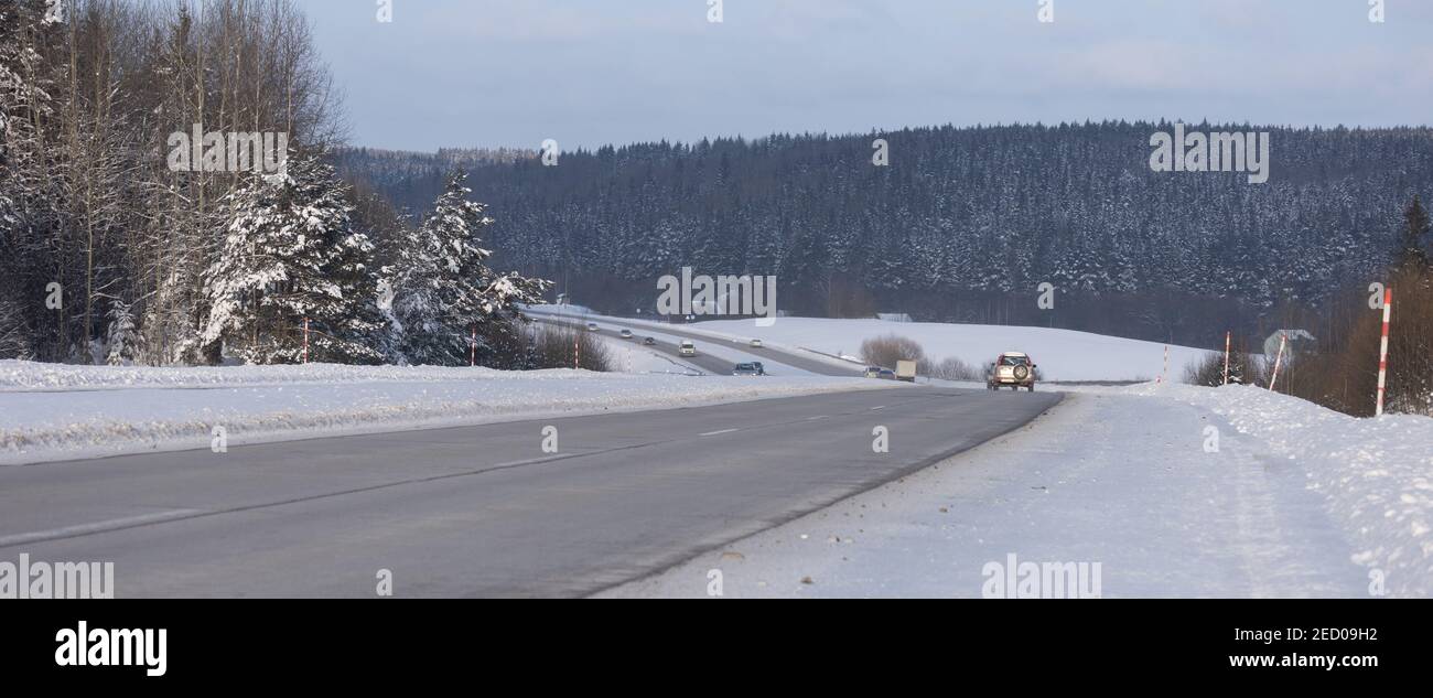 Winter landscape, road and shoulder covered with snow Stock Photo - Alamy