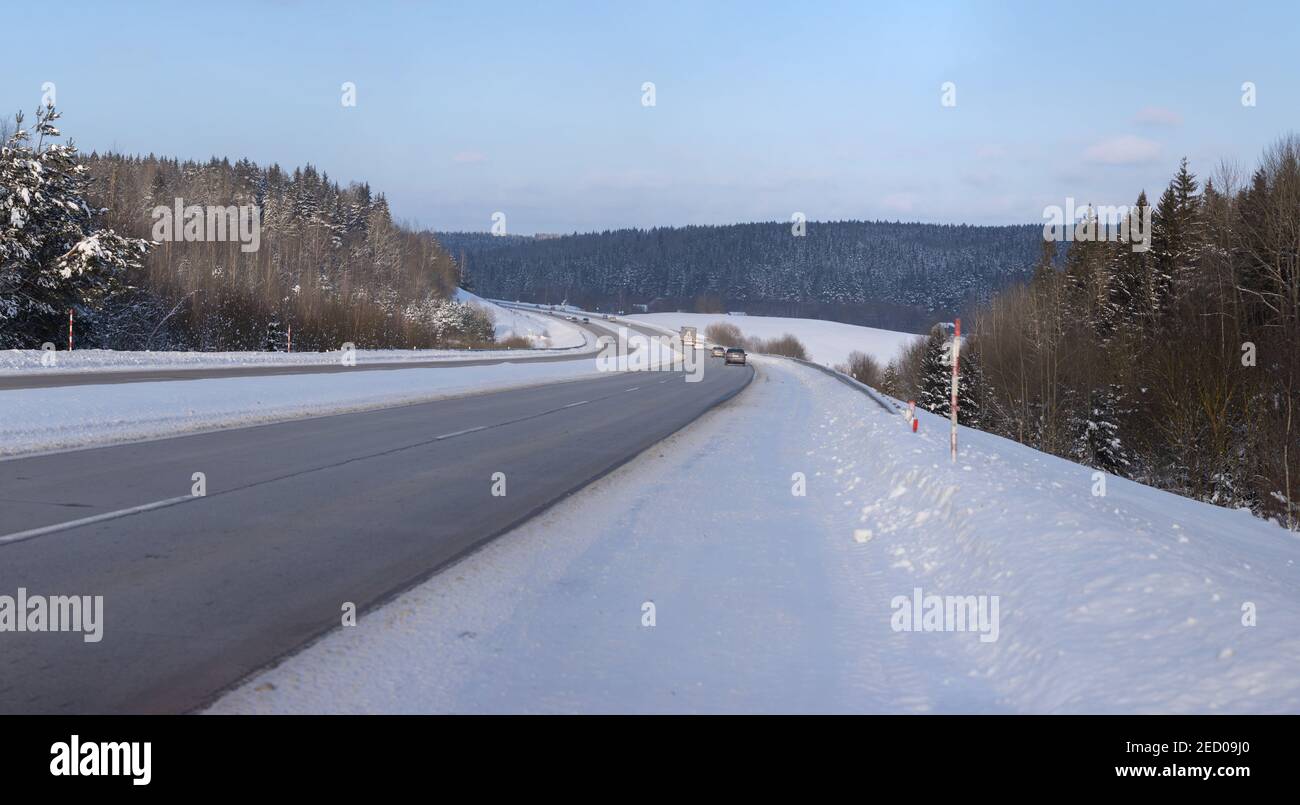 Winter landscape, road and shoulder covered with snow Stock Photo - Alamy