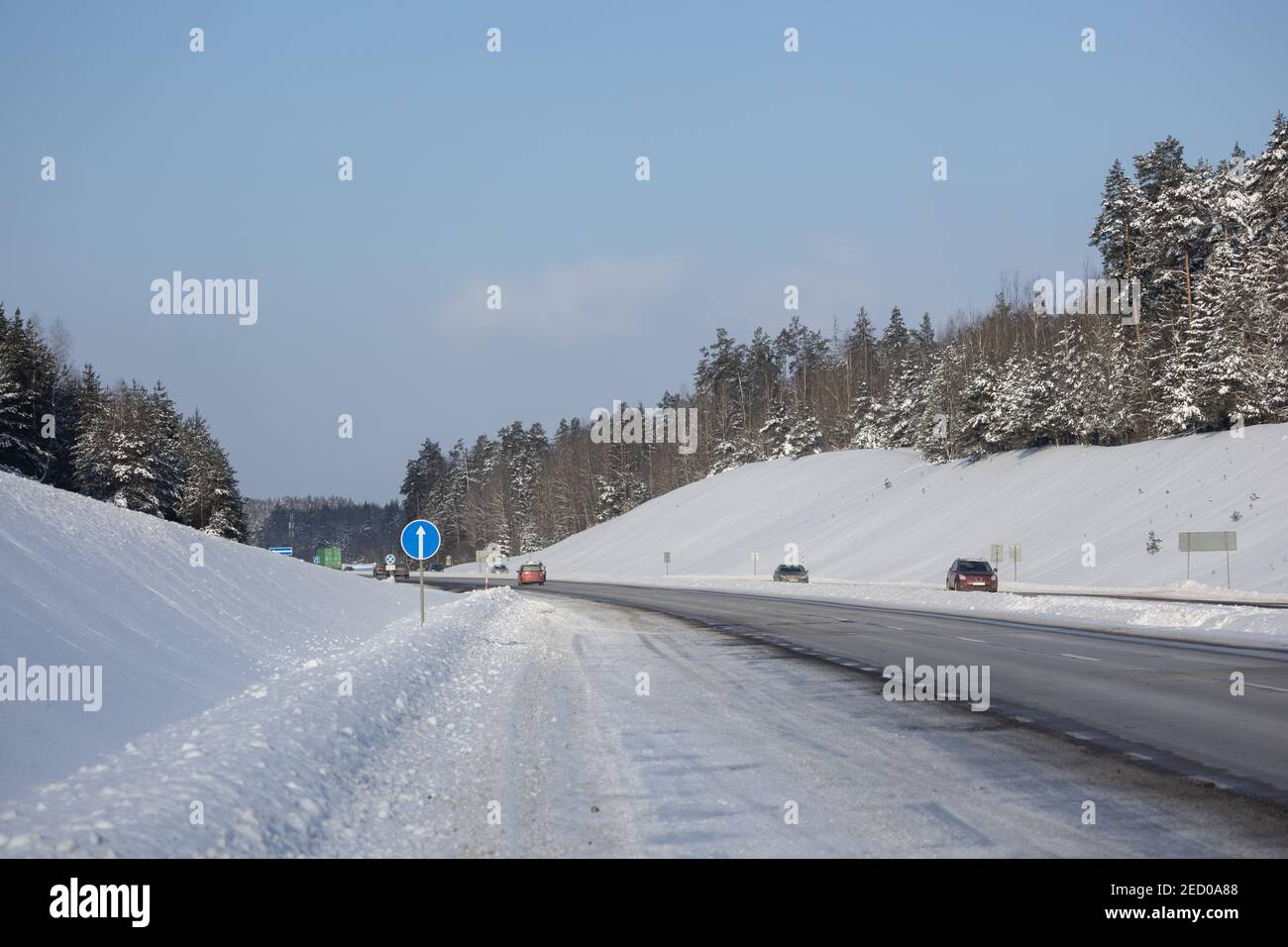 Winter road with snow, highway with cars at sunset Stock Photo - Alamy