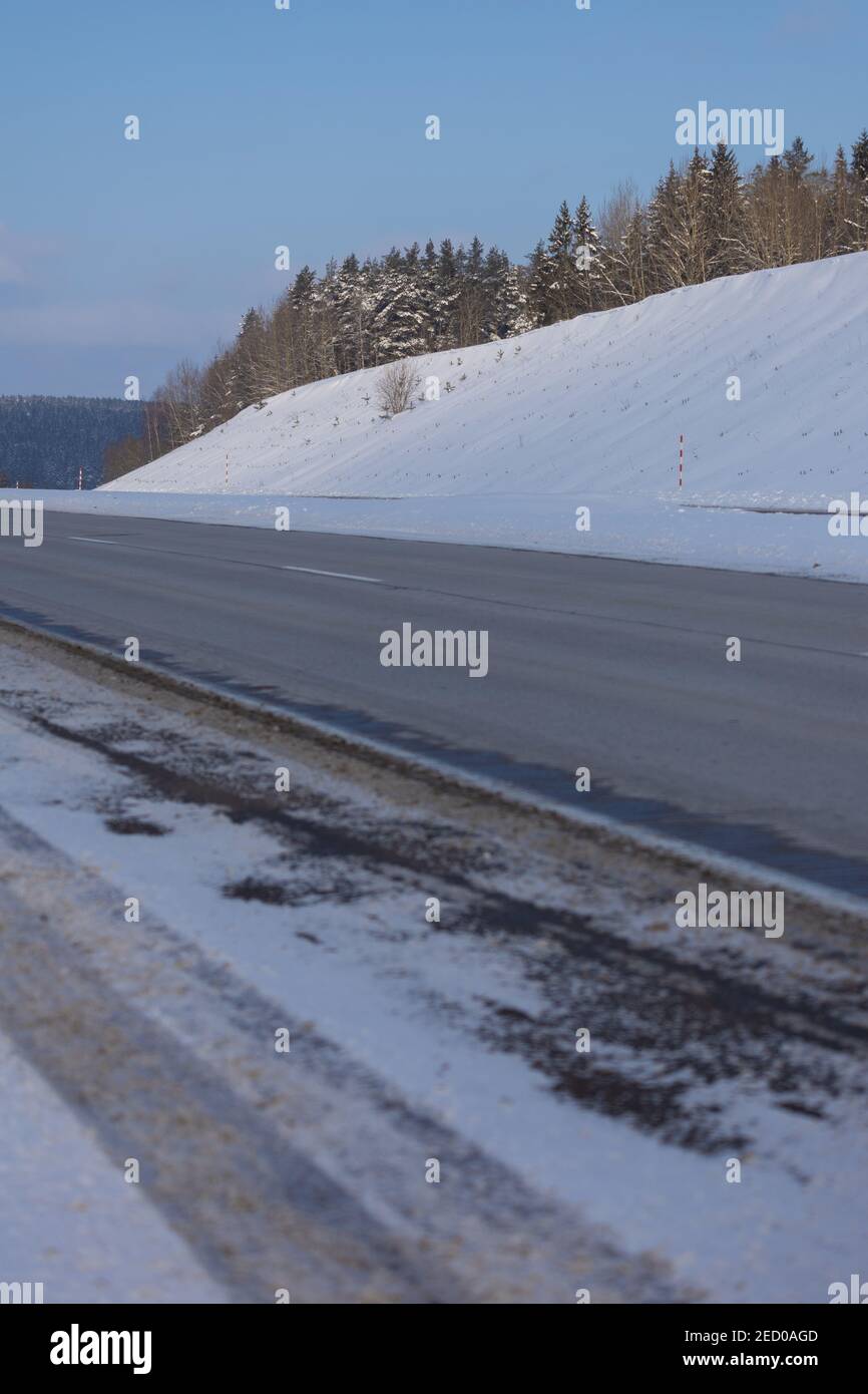 Winter road with snow, highway with cars at sunset Stock Photo - Alamy