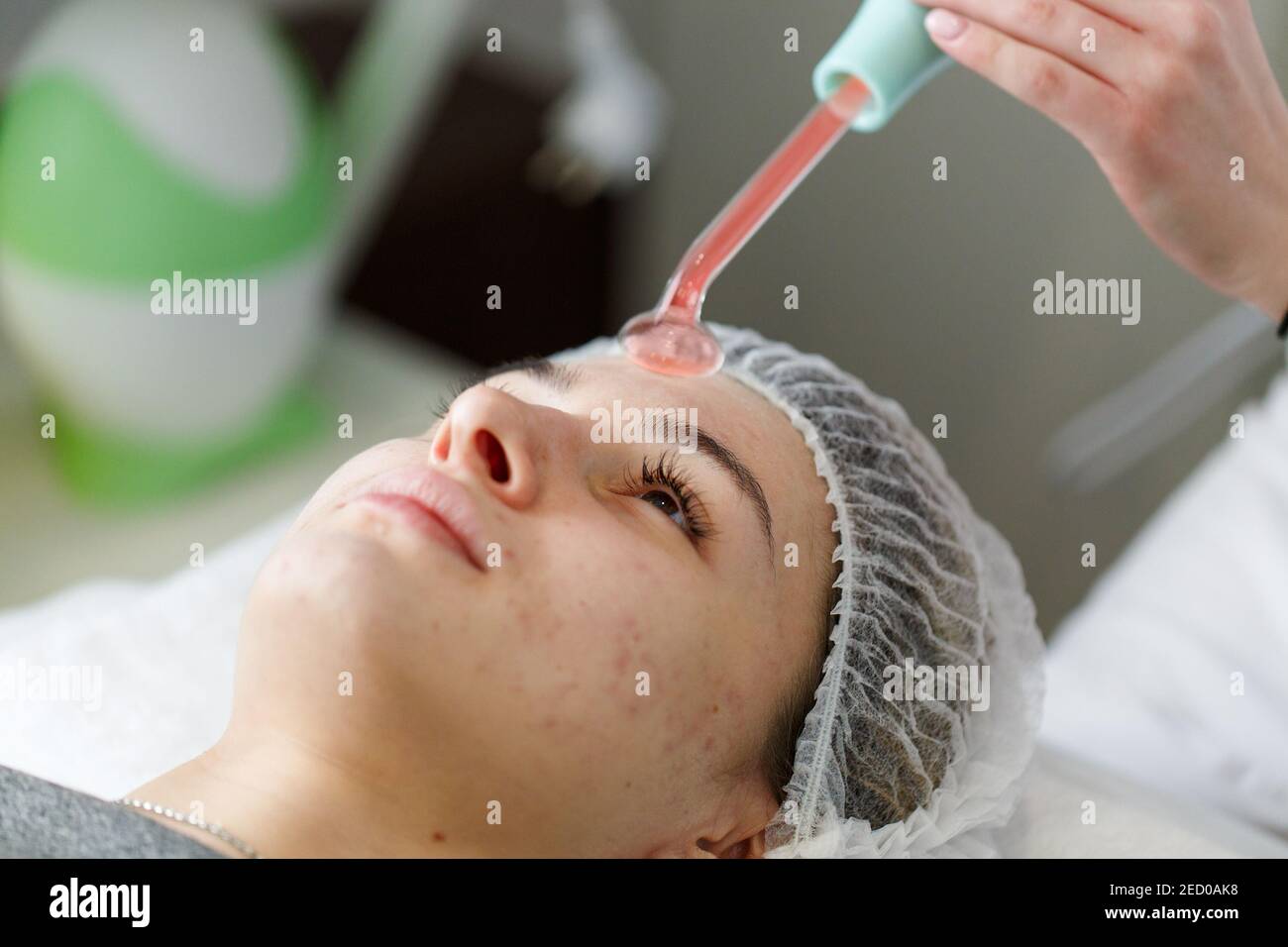 Violet ray treatment on face at the beautician. A violet ray is an ...
