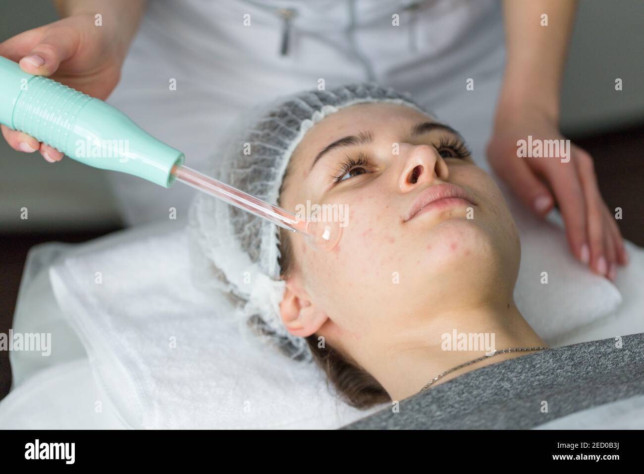 Violet ray treatment on face at the beautician. A violet ray is an ...