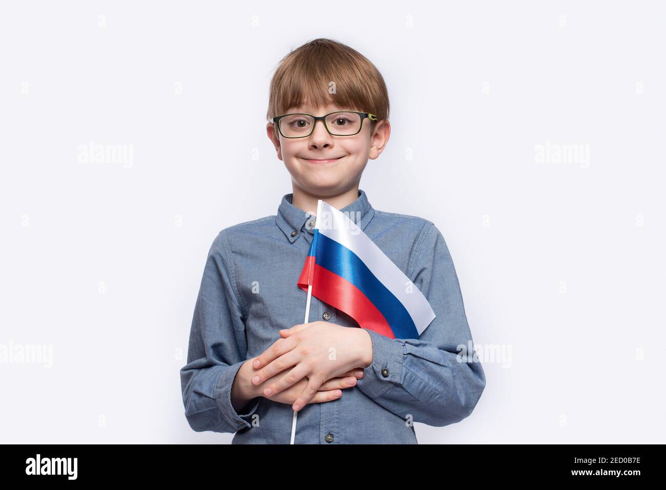 Portrait of boy with flag of Russia isolated on white background ...