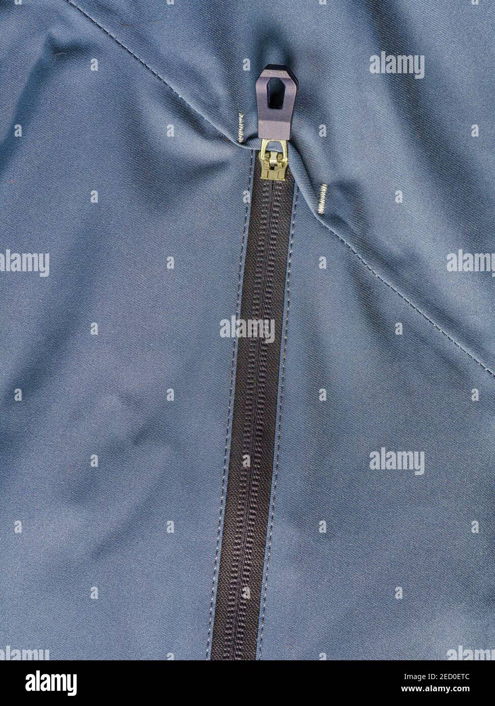 Modern taped zipper on ski jacket close up. Large macro fabric and ...