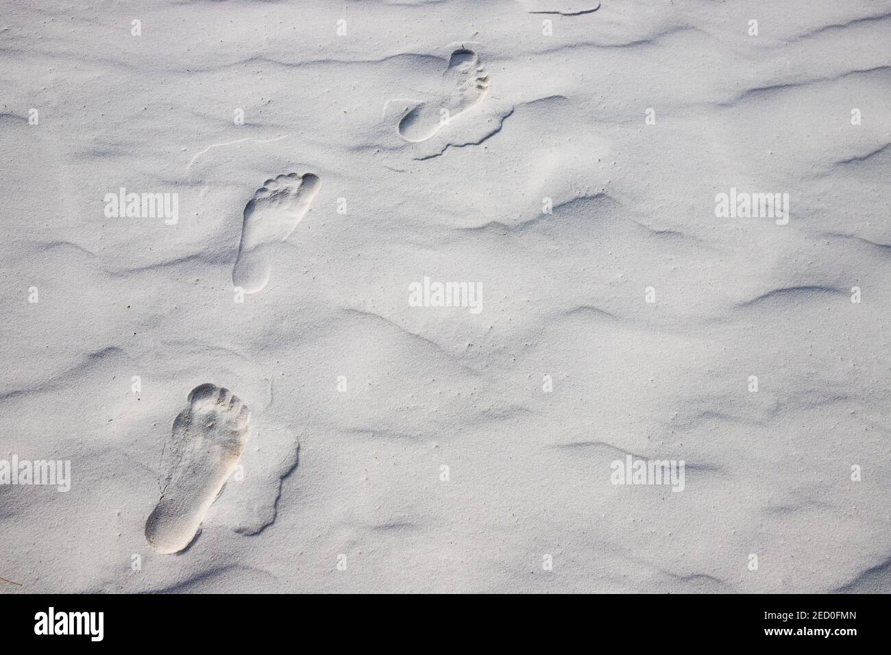 Foot marks on white sand beach. Barefoot walk marks. Relaxing day on ...