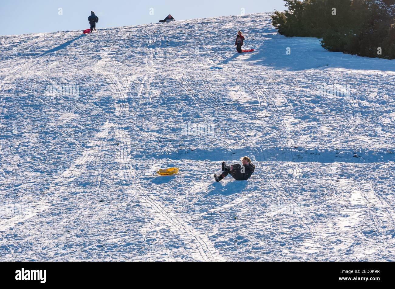 Child on sled hi-res stock photography and images - Alamy