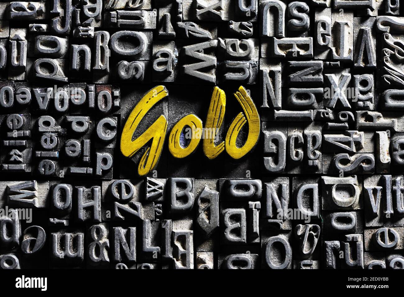 Old lead letters with golden writing, word gold Stock Photo - Alamy
