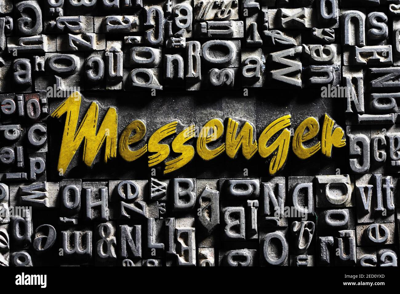 Old lead letters with golden writing, word messenger Stock Photo - Alamy