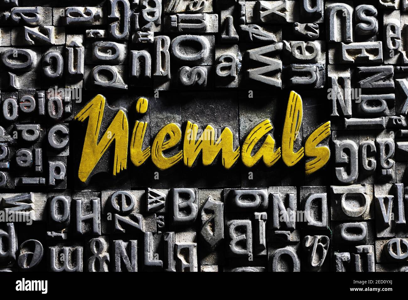 Old lead letters with golden writing, word Never Stock Photo - Alamy