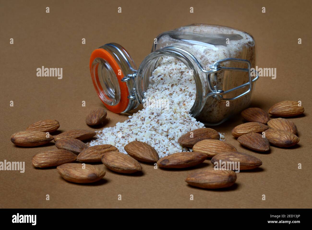 Ground almonds in overturned preserving jar, sweet almonds, Germany ...