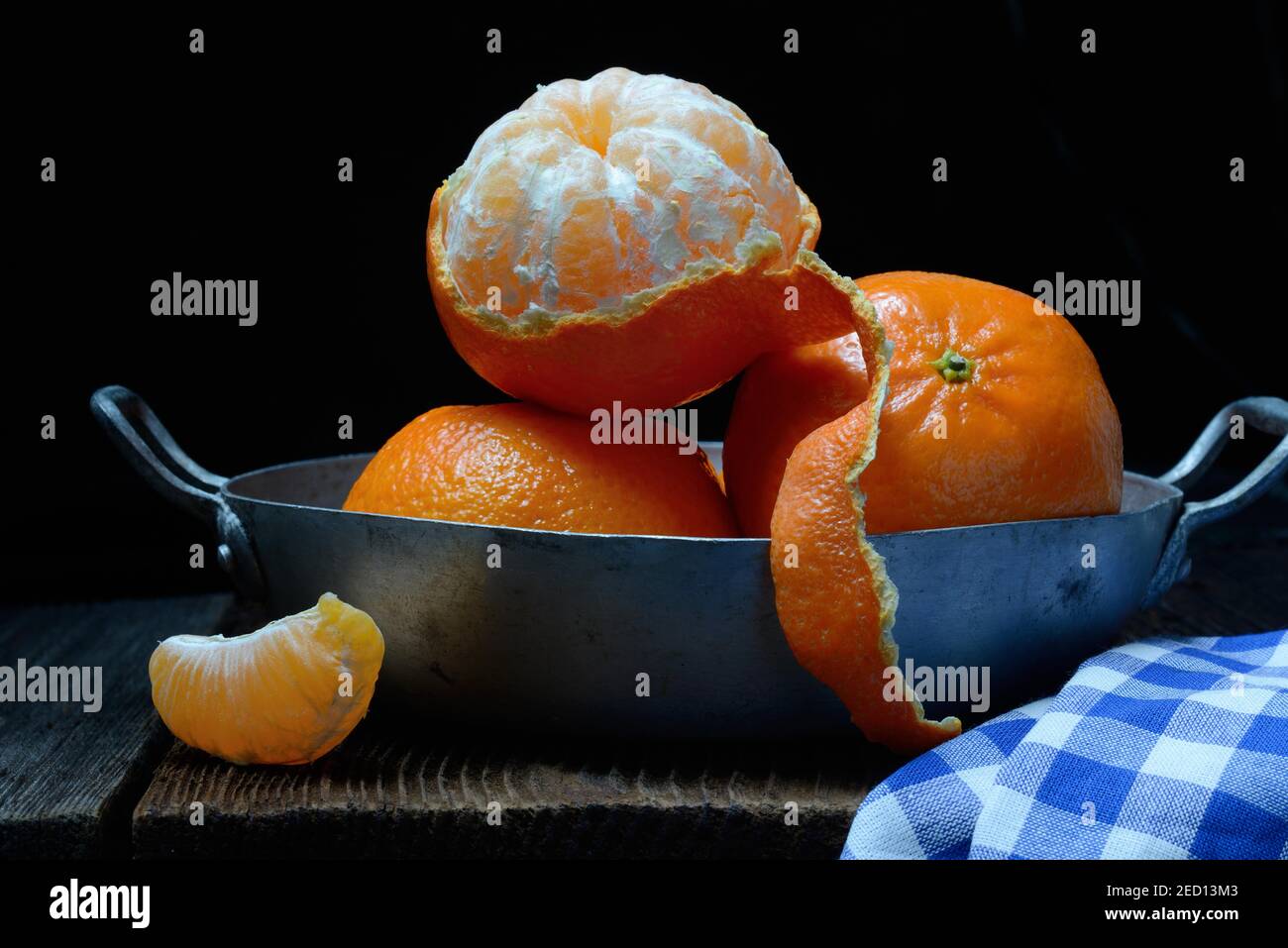 Clementines in a pan, unpeeled and half-peeled, Germany Stock Photo - Alamy
