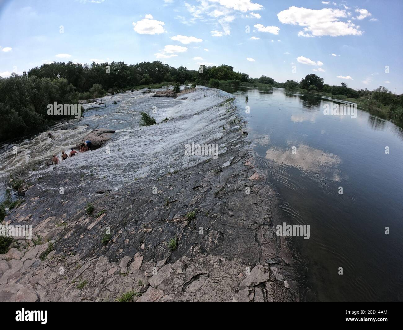 Water flows through the dam of Mygiivska HPP. Rapids and river dam on ...