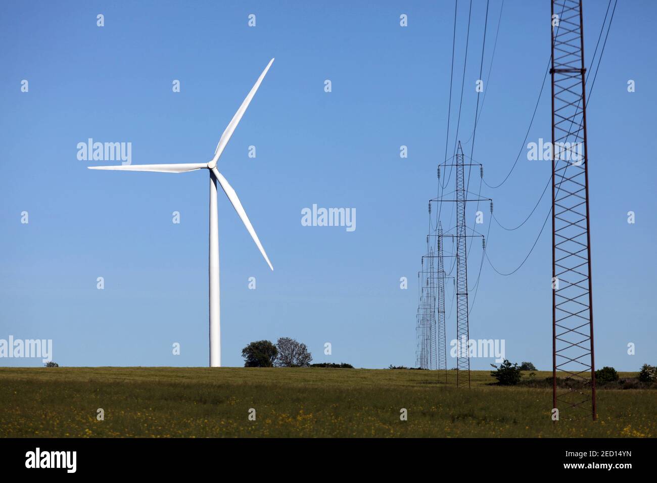 A wind turbine and high voltage power line Stock Photo - Alamy