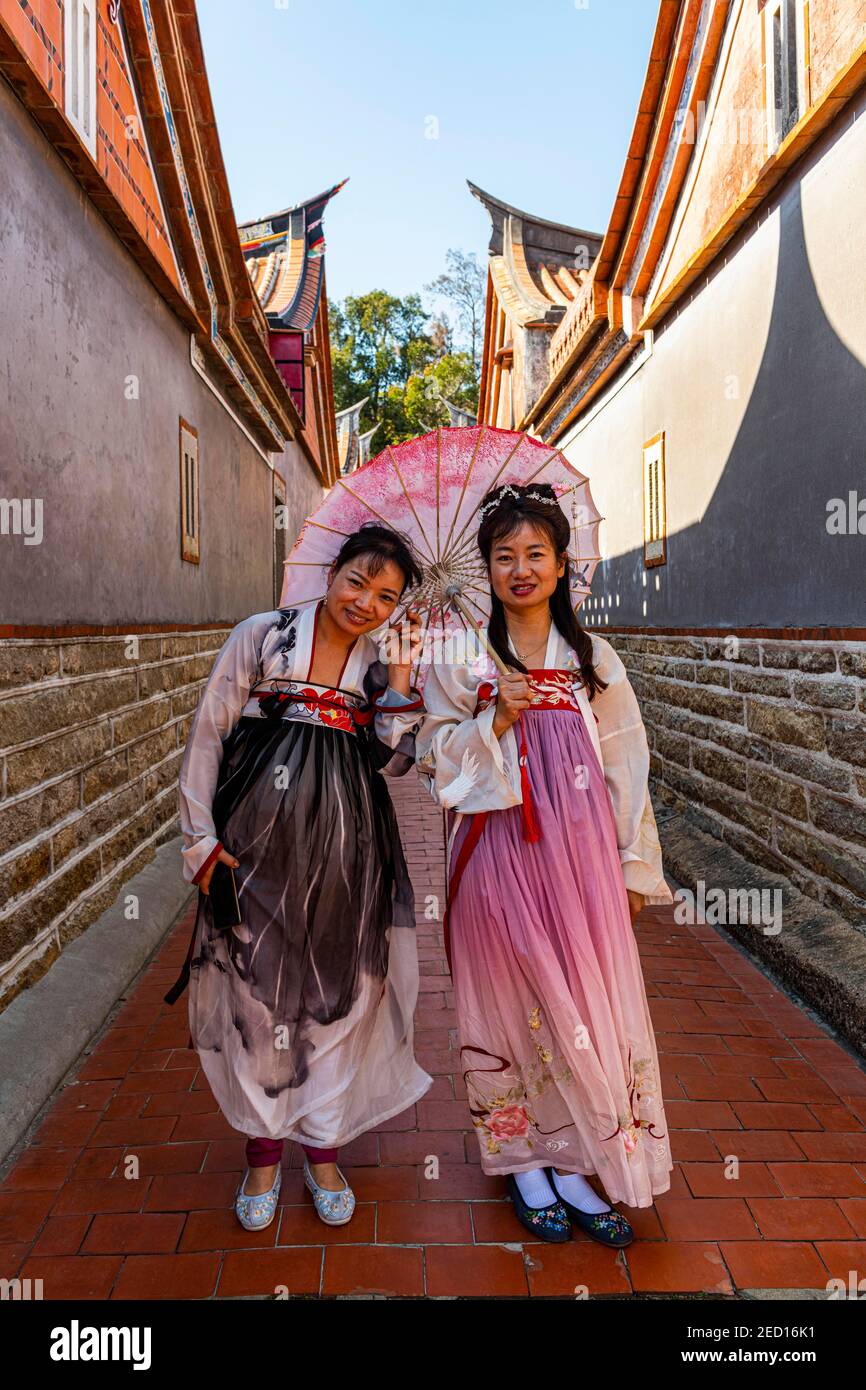 Local dressed women in the traditional Minnan-style houses, Shanhou ...