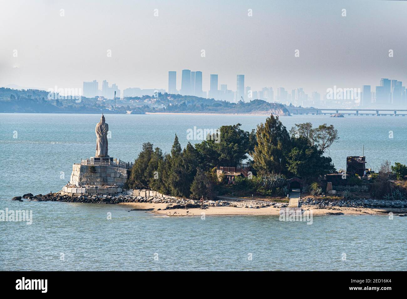 Buddha statue on an island with Xiamen in the background, Kinmen island ...
